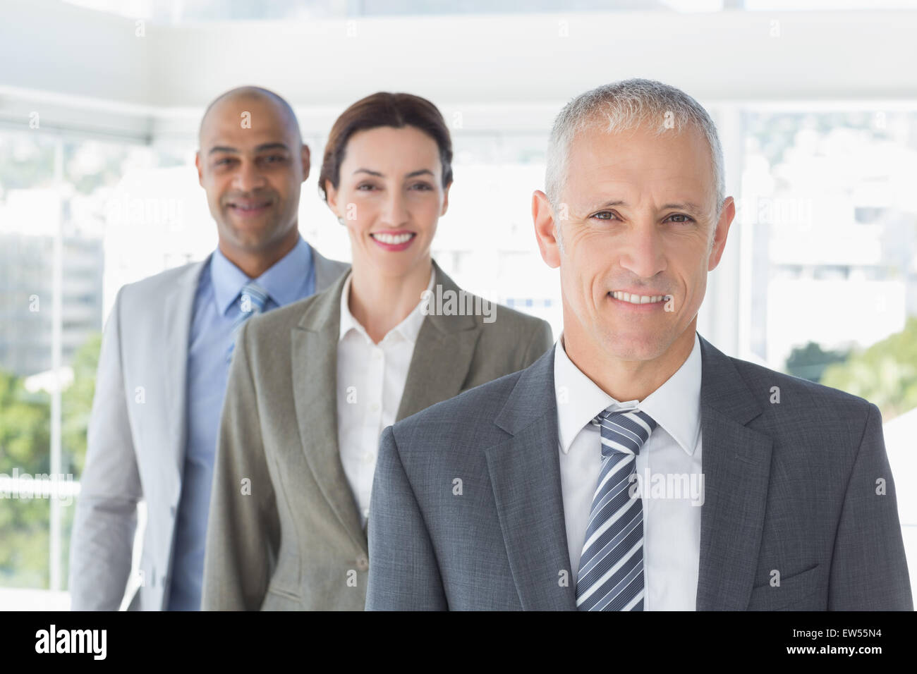 Business colleagues smiling at camera Stock Photo - Alamy