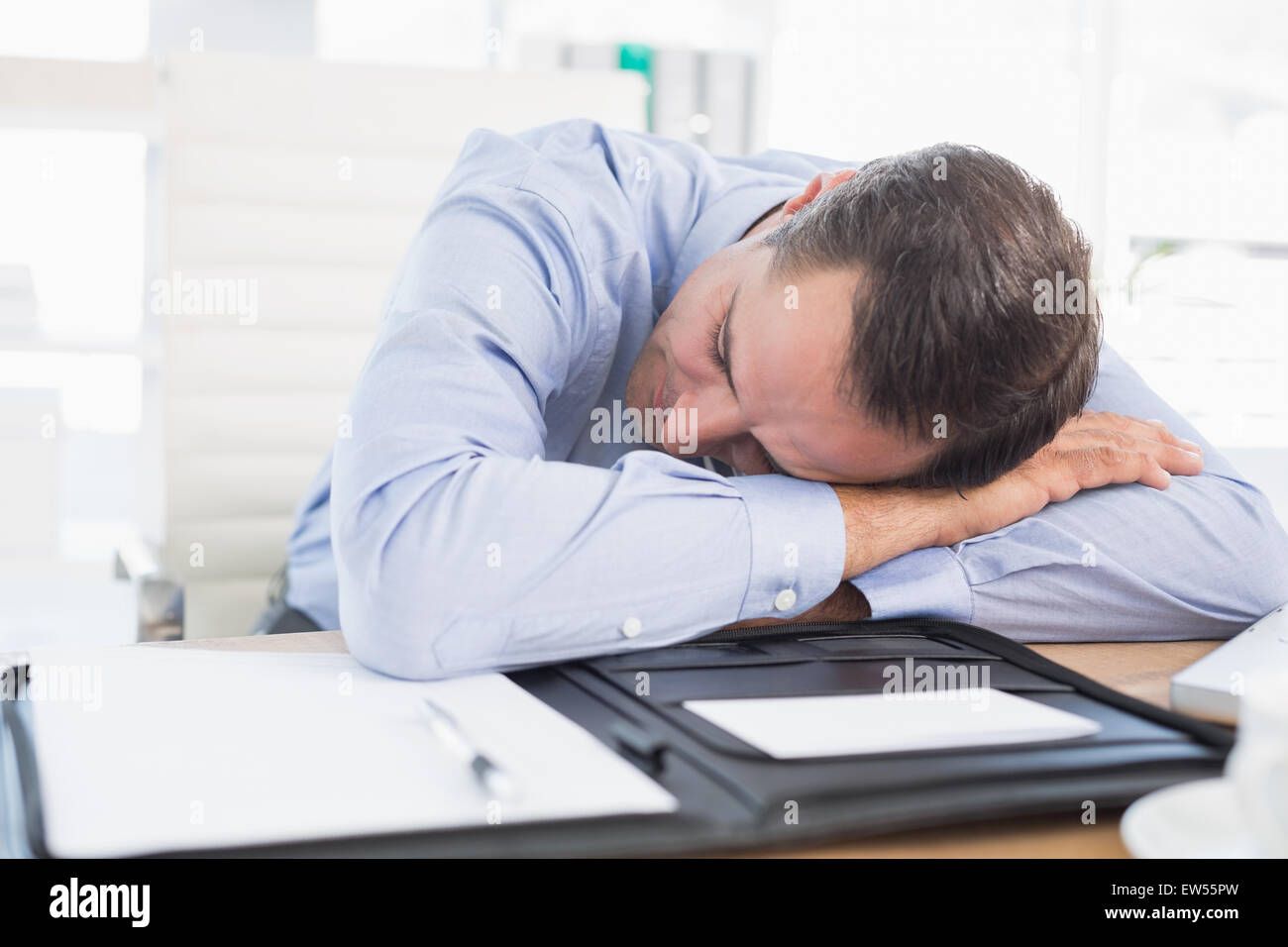Sleeping businessman in his office Stock Photo - Alamy