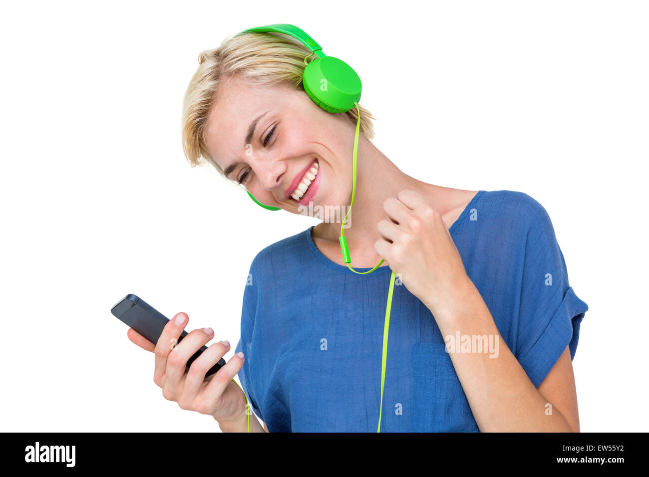 Happy blonde woman listening music with her mobile phone Stock Photo ...