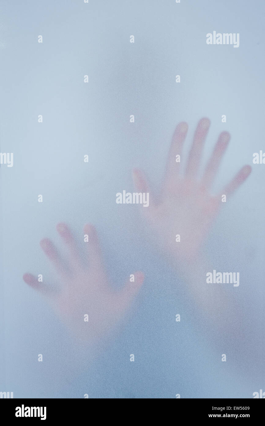 Hands touching frosted glass Stock Photo - Alamy