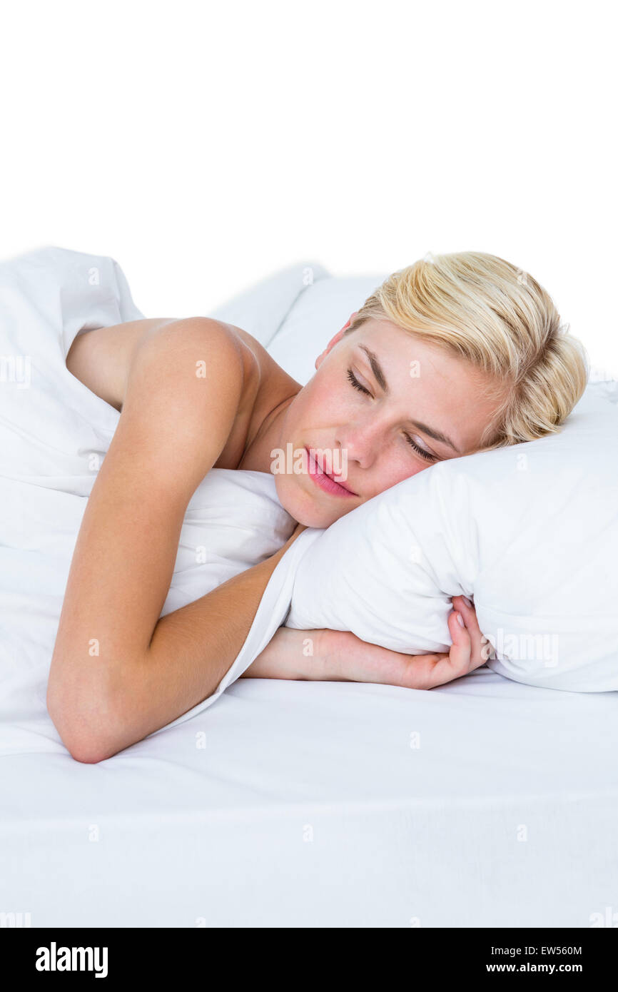 Smiling blonde woman napping in her bed Stock Photo - Alamy