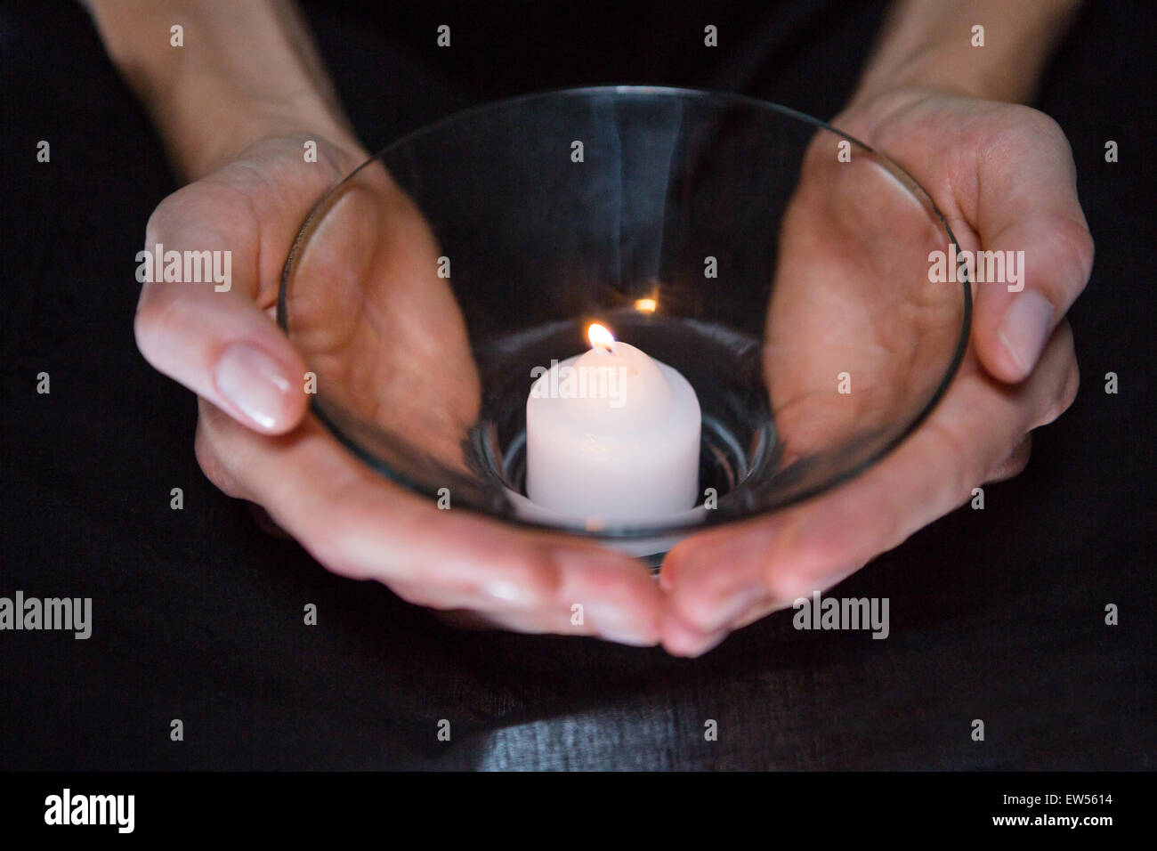 Hands holding candle Stock Photo - Alamy