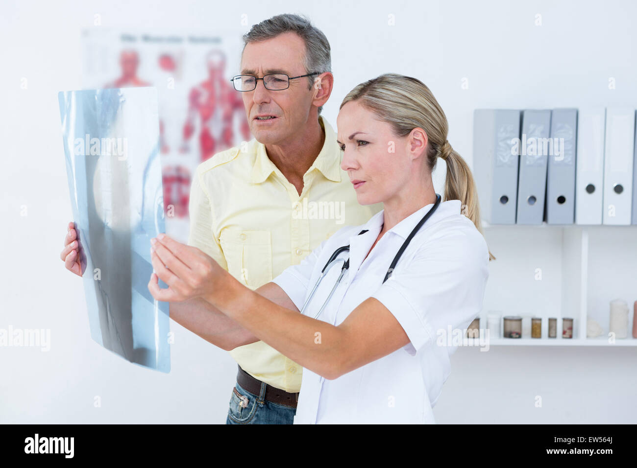 Doctor showing X rays to her patient Stock Photo - Alamy