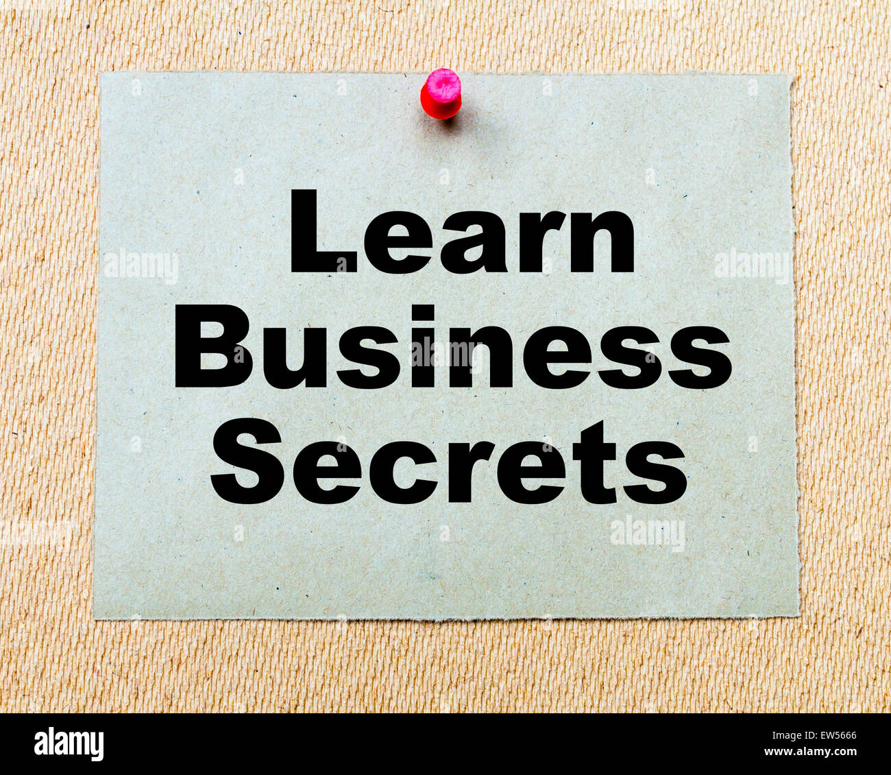 Learn Business Secrets written on paper note pinned with red thumbtack ...