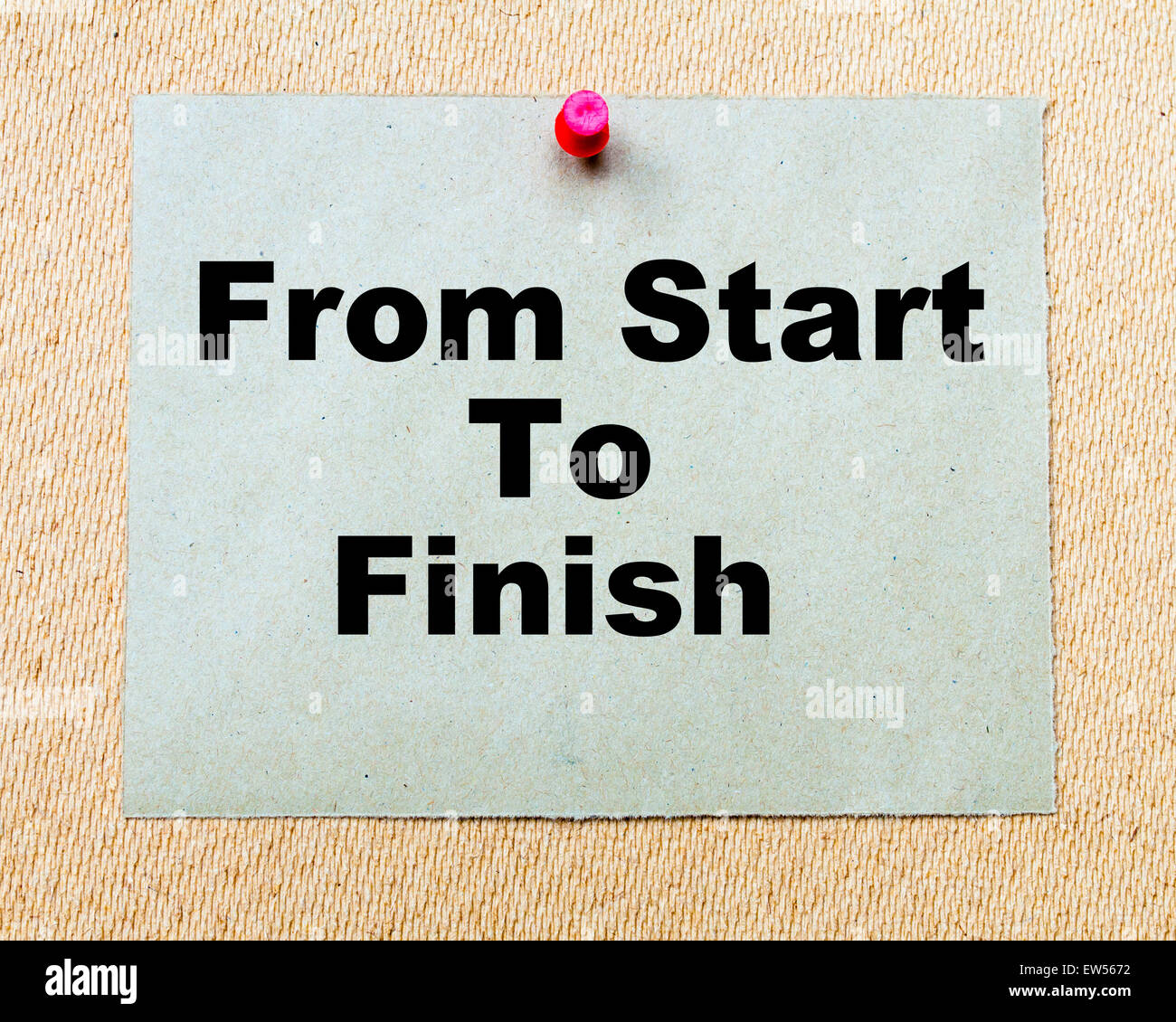 From Start To Finish written on paper note pinned with red thumbtack on ...