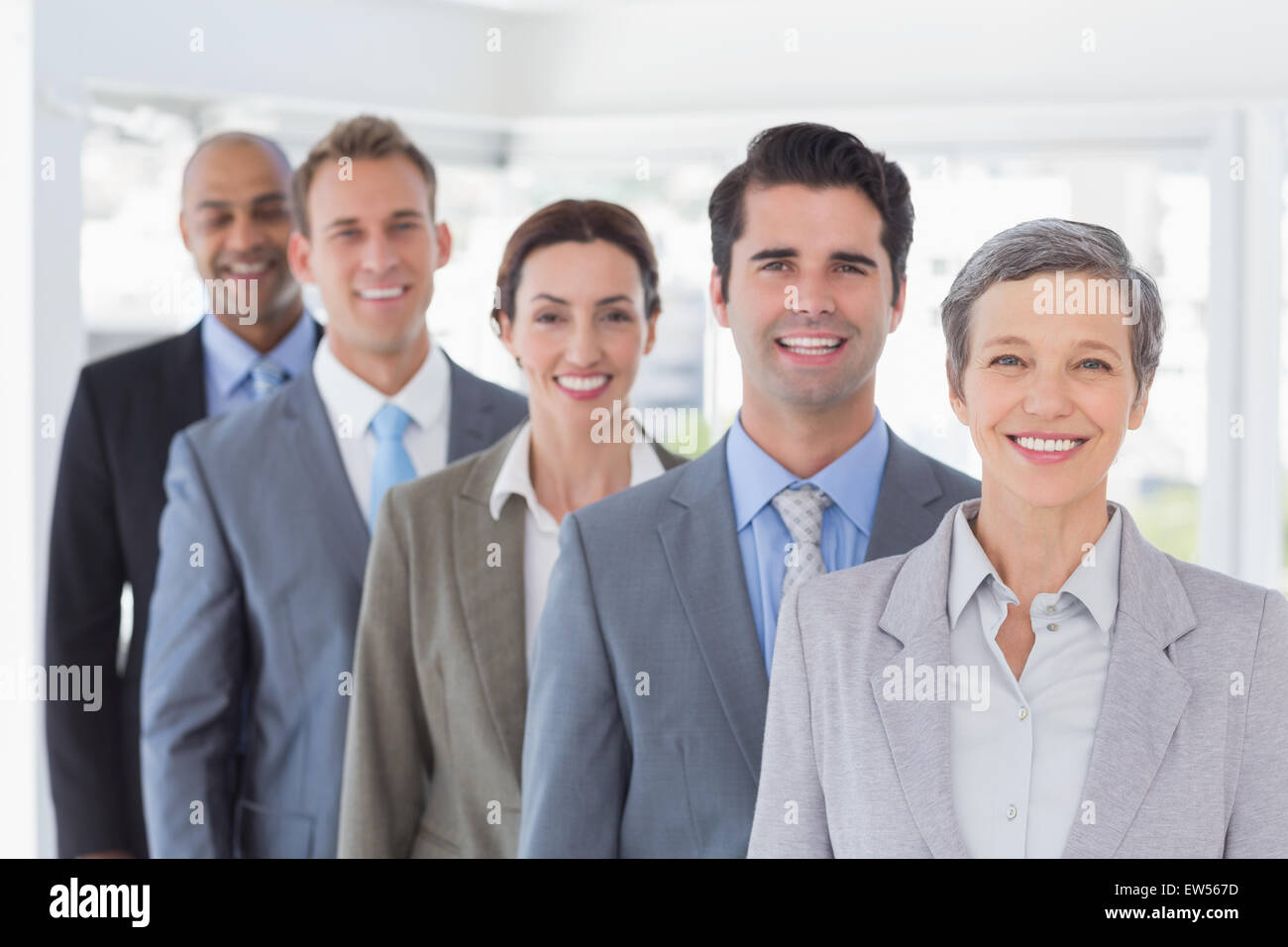 Business people standing in a row Stock Photo - Alamy