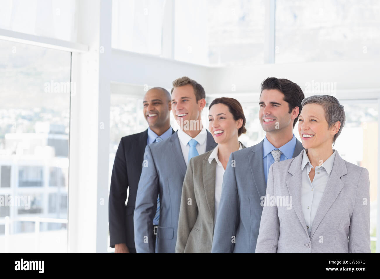 Business people standing in a row Stock Photo - Alamy