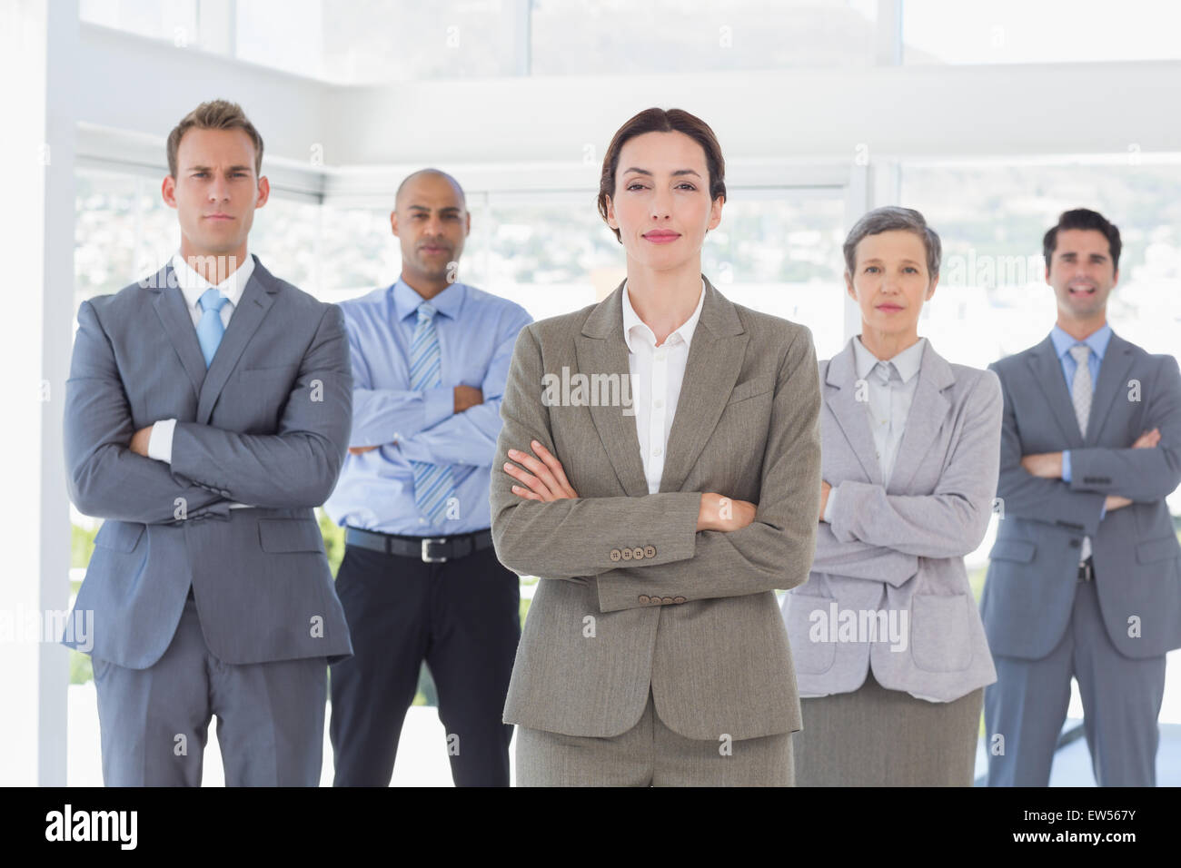 Portrait business partners standing arms hi-res stock photography and ...