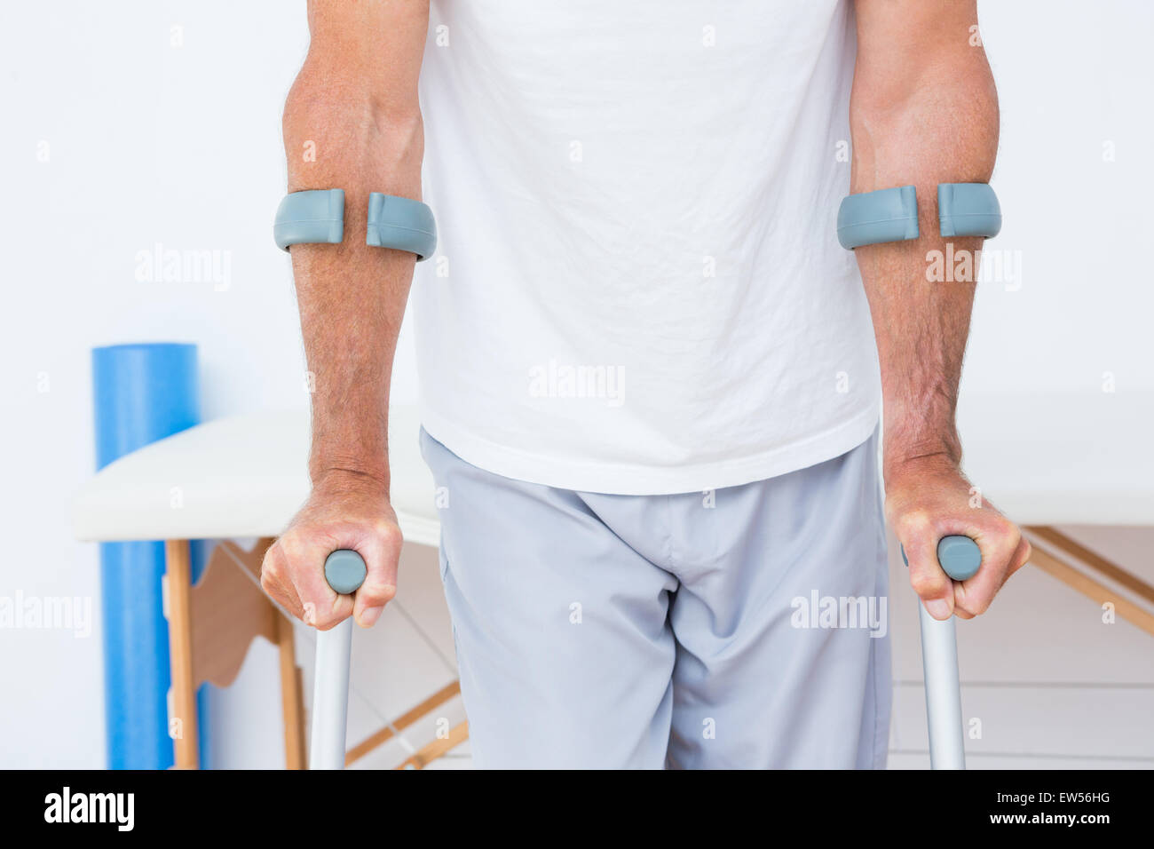 Patient standing with crutch Stock Photo - Alamy