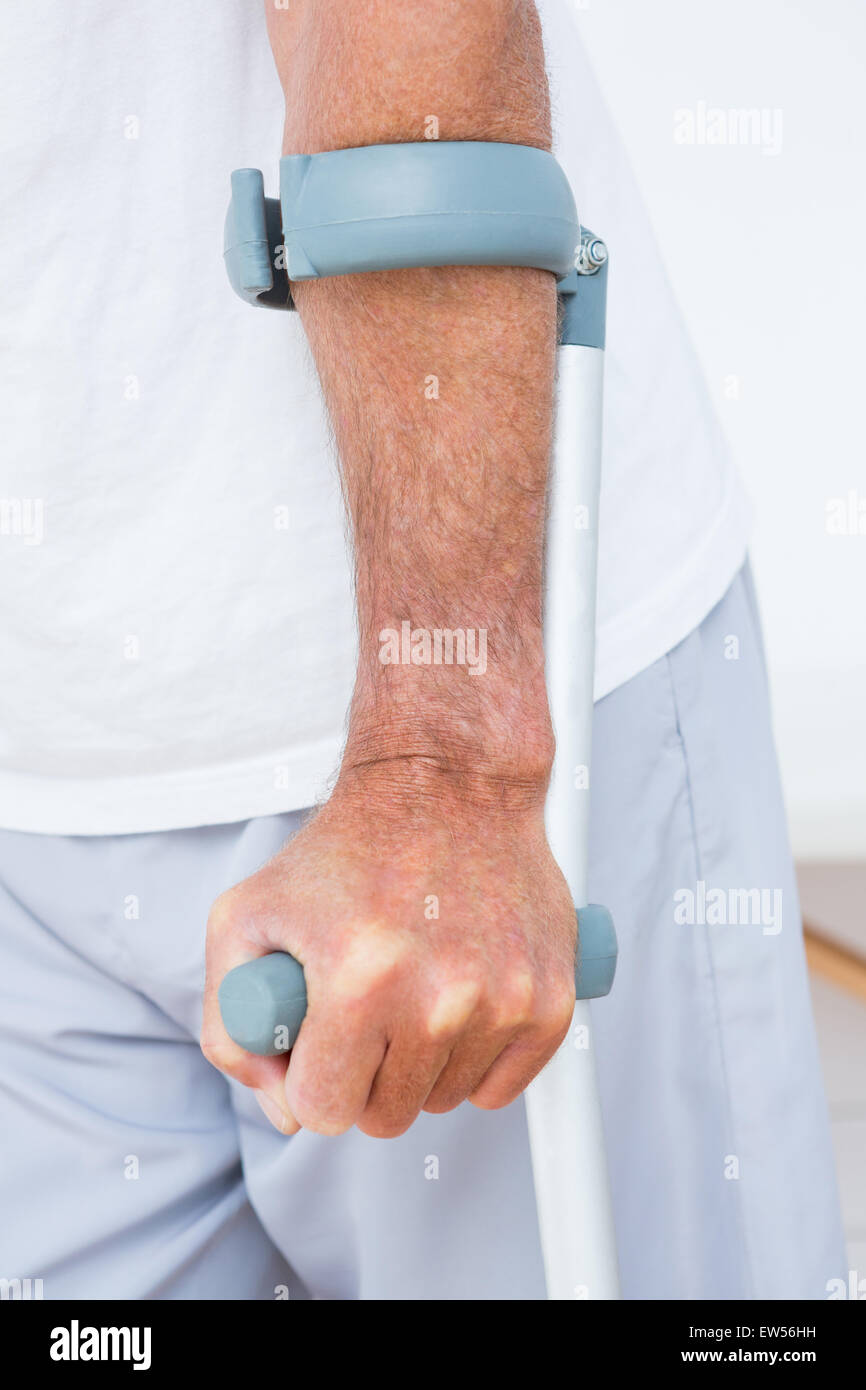 Patient standing with crutch Stock Photo - Alamy