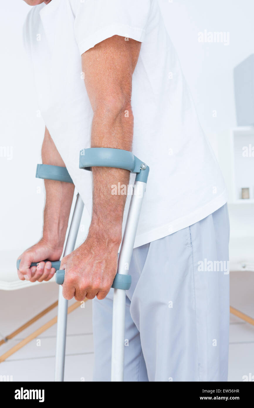 Patient standing with crutch Stock Photo - Alamy