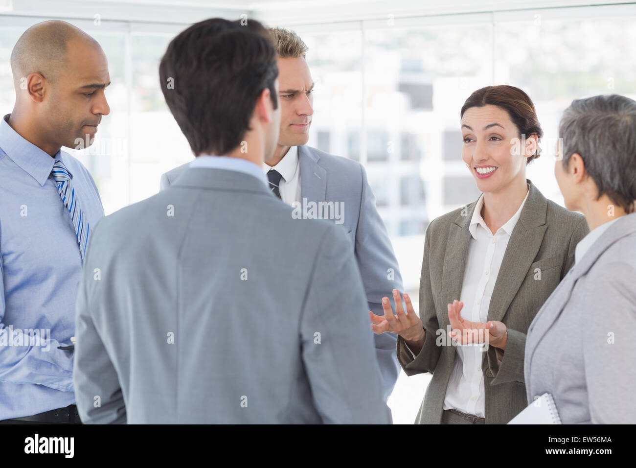 Business team having a conversation Stock Photo - Alamy