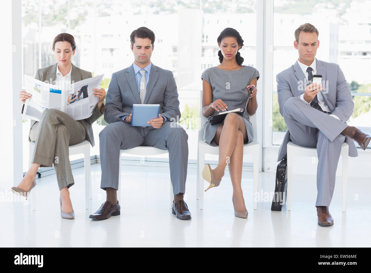 Business people sitting and waiting Stock Photo - Alamy