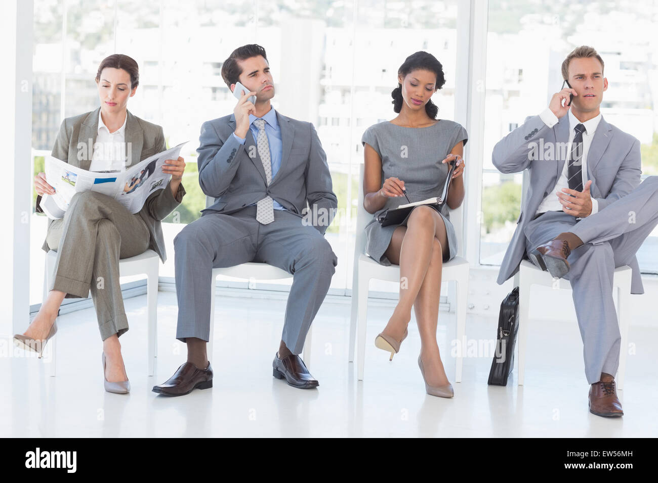 Business people sitting and waiting Stock Photo - Alamy