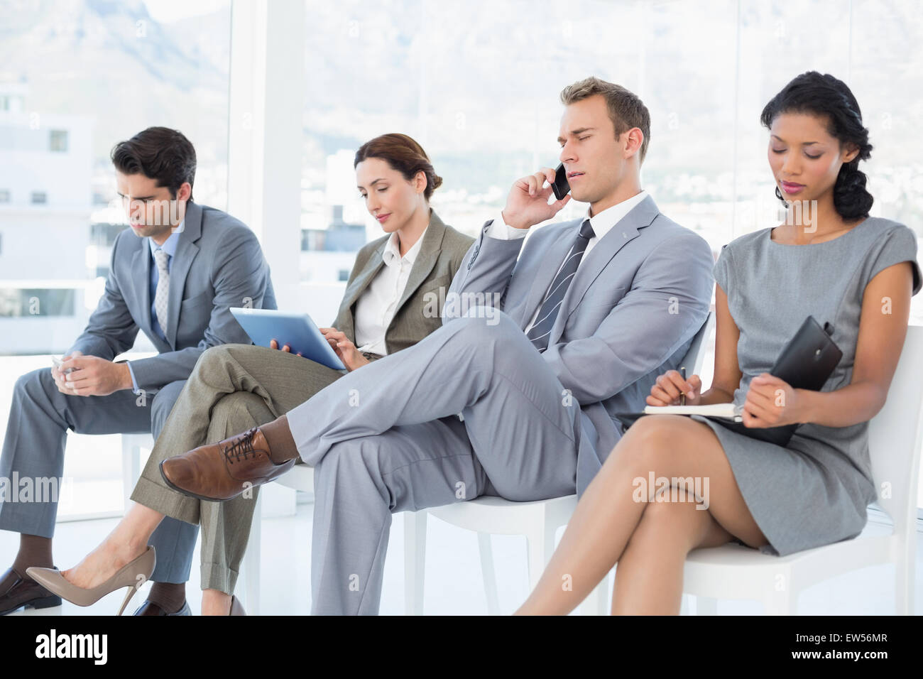 Business people sitting and waiting Stock Photo - Alamy