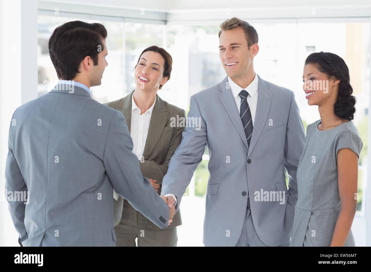 Business team meeting their partner Stock Photo - Alamy