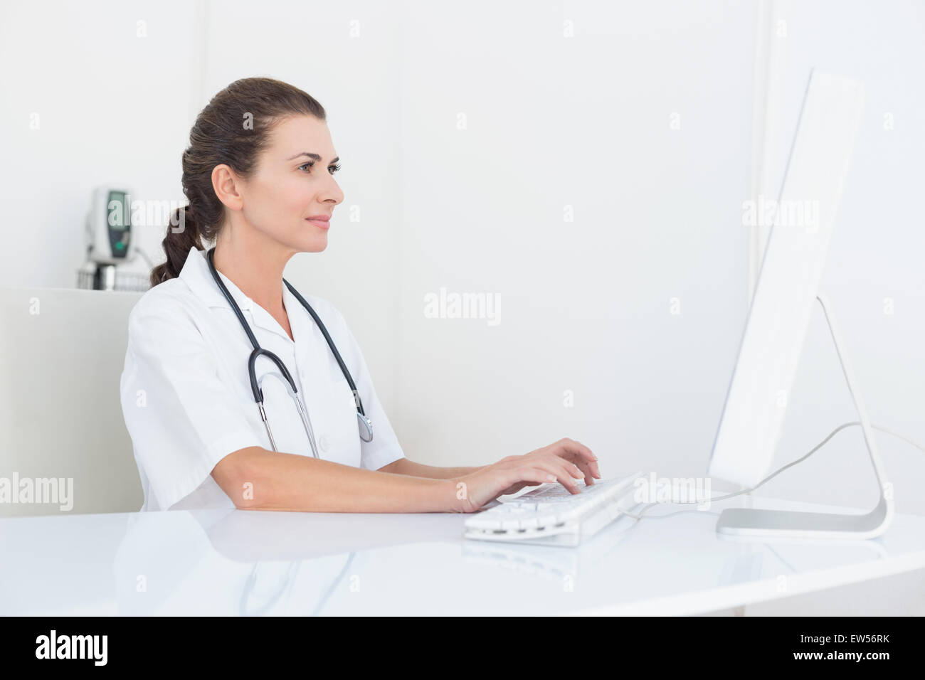 Concentrating doctor using computer Stock Photo - Alamy