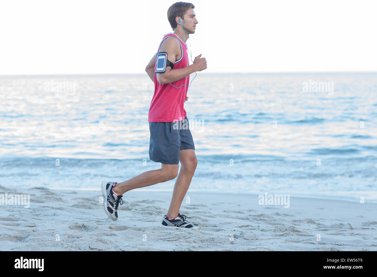 Handsome fit man running Stock Photo - Alamy