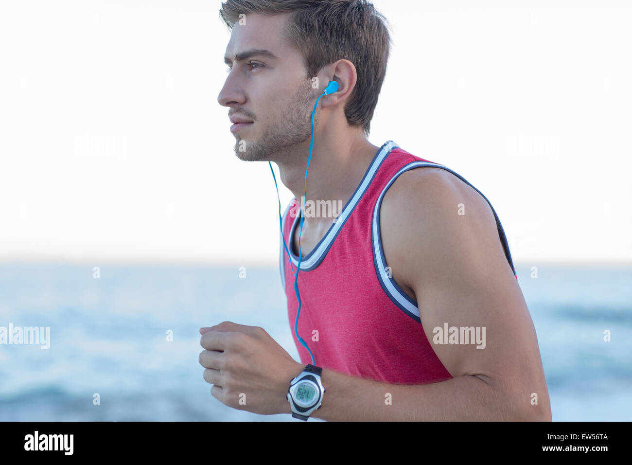 Handsome fit man running Stock Photo - Alamy