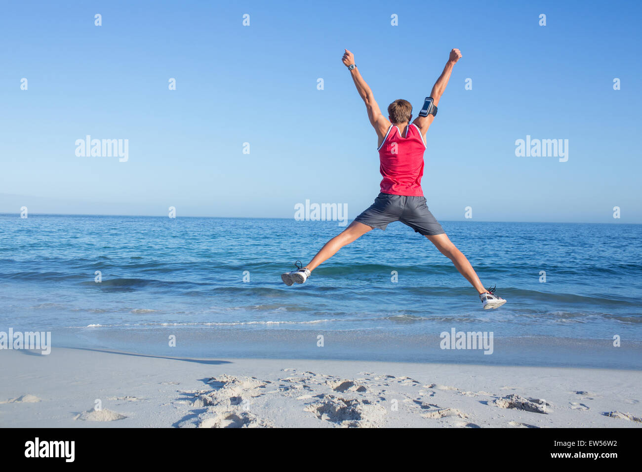 Handsome jumping young man hi-res stock photography and images - Alamy