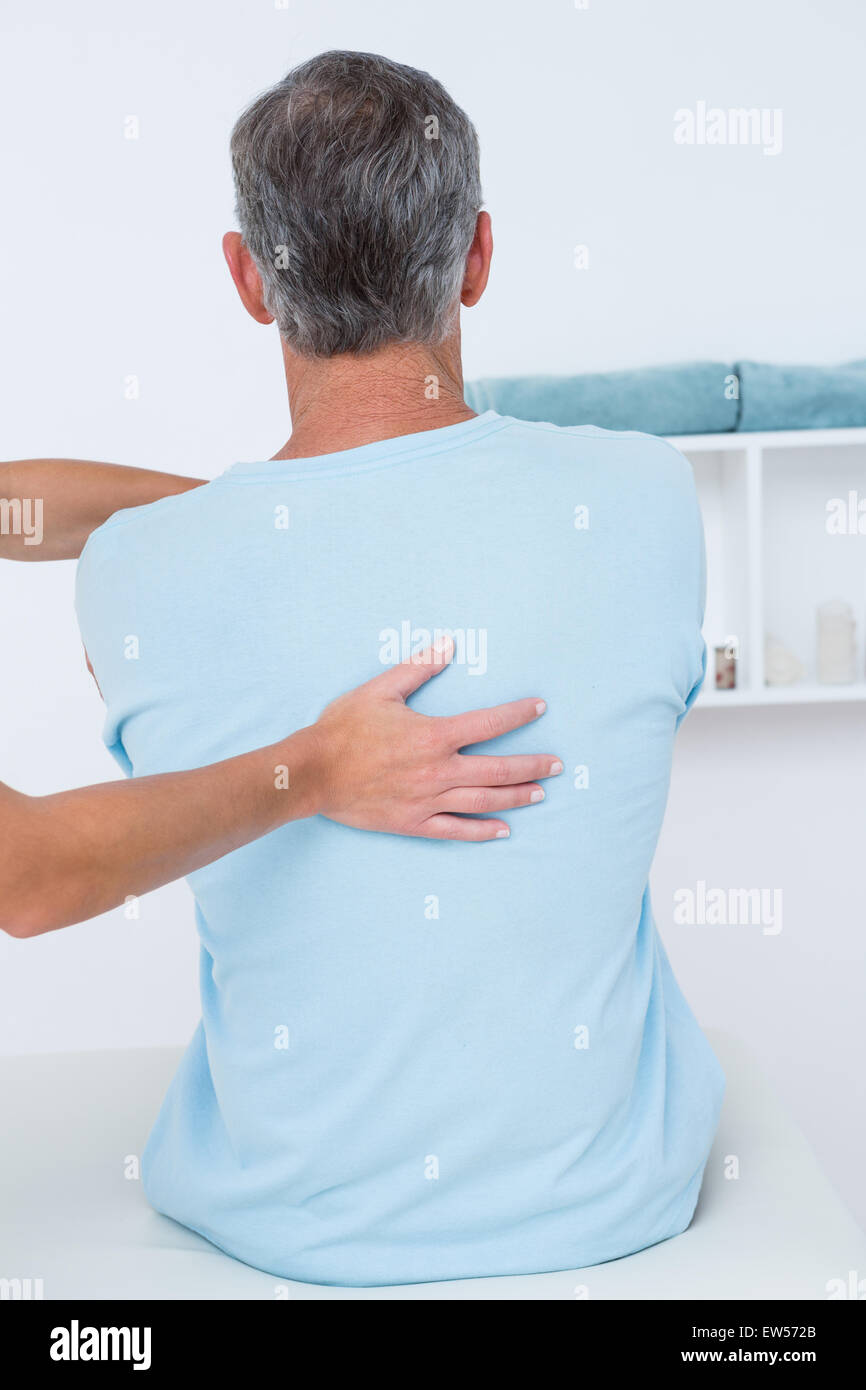 Doctor examining her patient back Stock Photo - Alamy