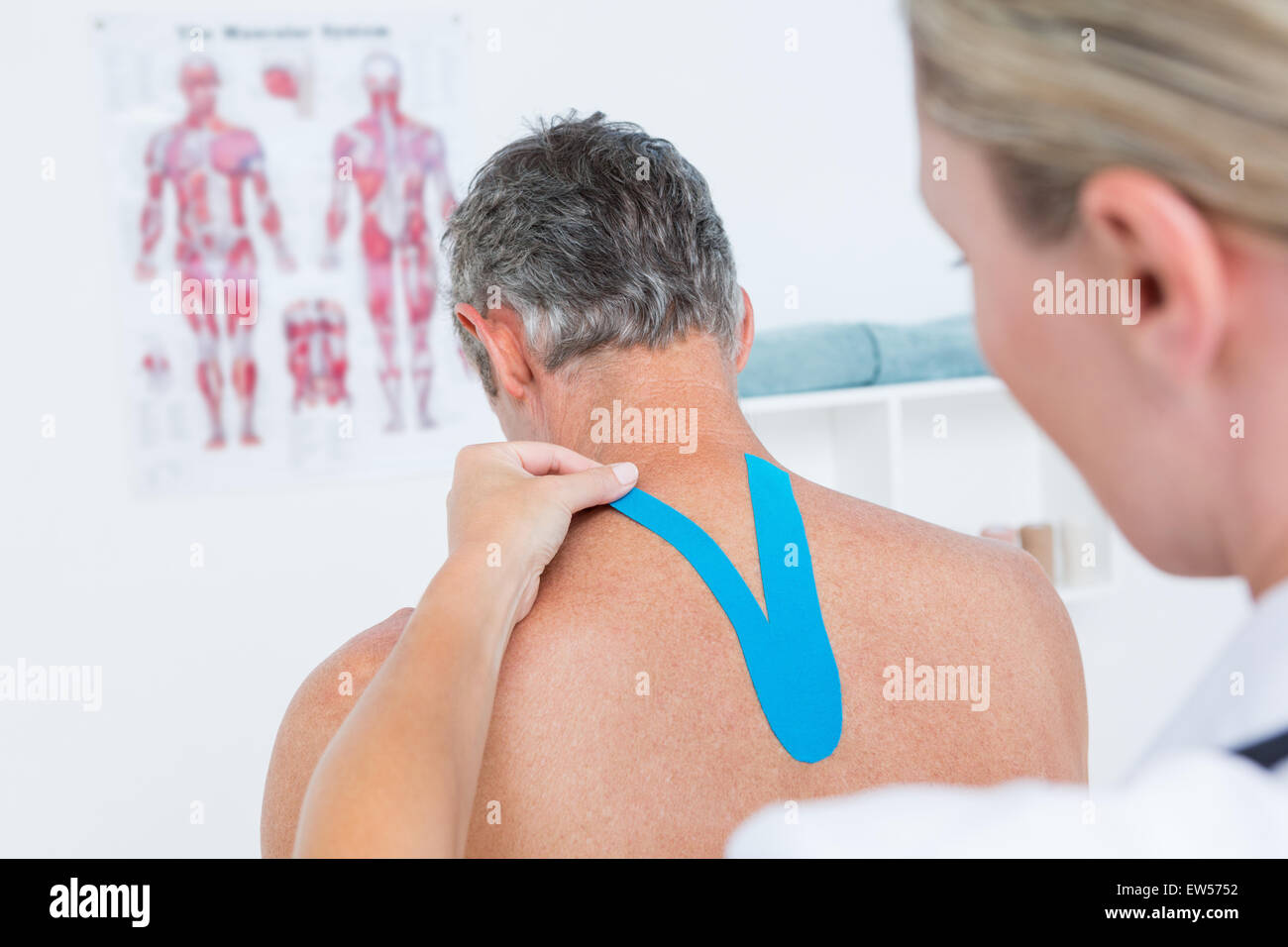 Doctor examining her patient back Stock Photo - Alamy