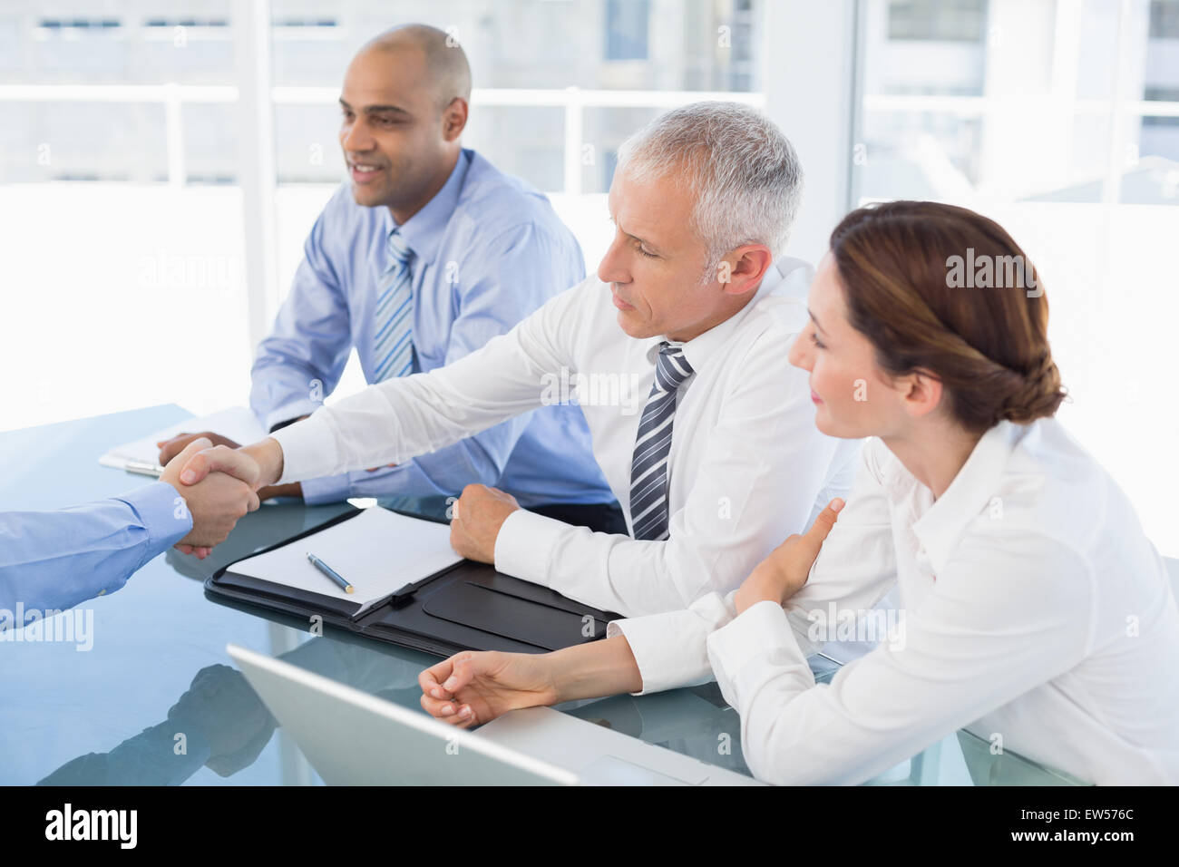Businessman shaking hand during work interview Stock Photo - Alamy