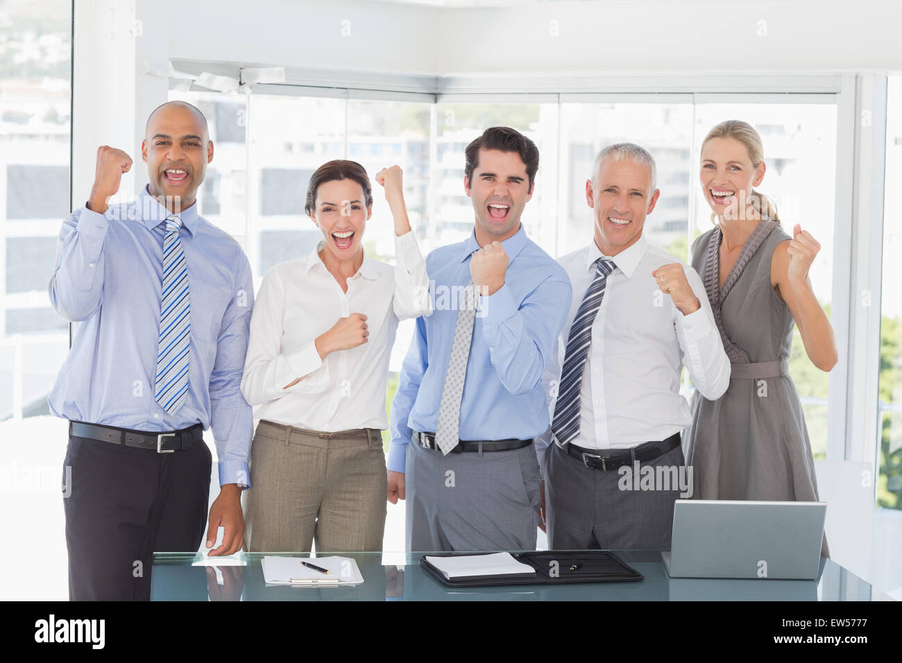 Business team celebrating a good job Stock Photo - Alamy