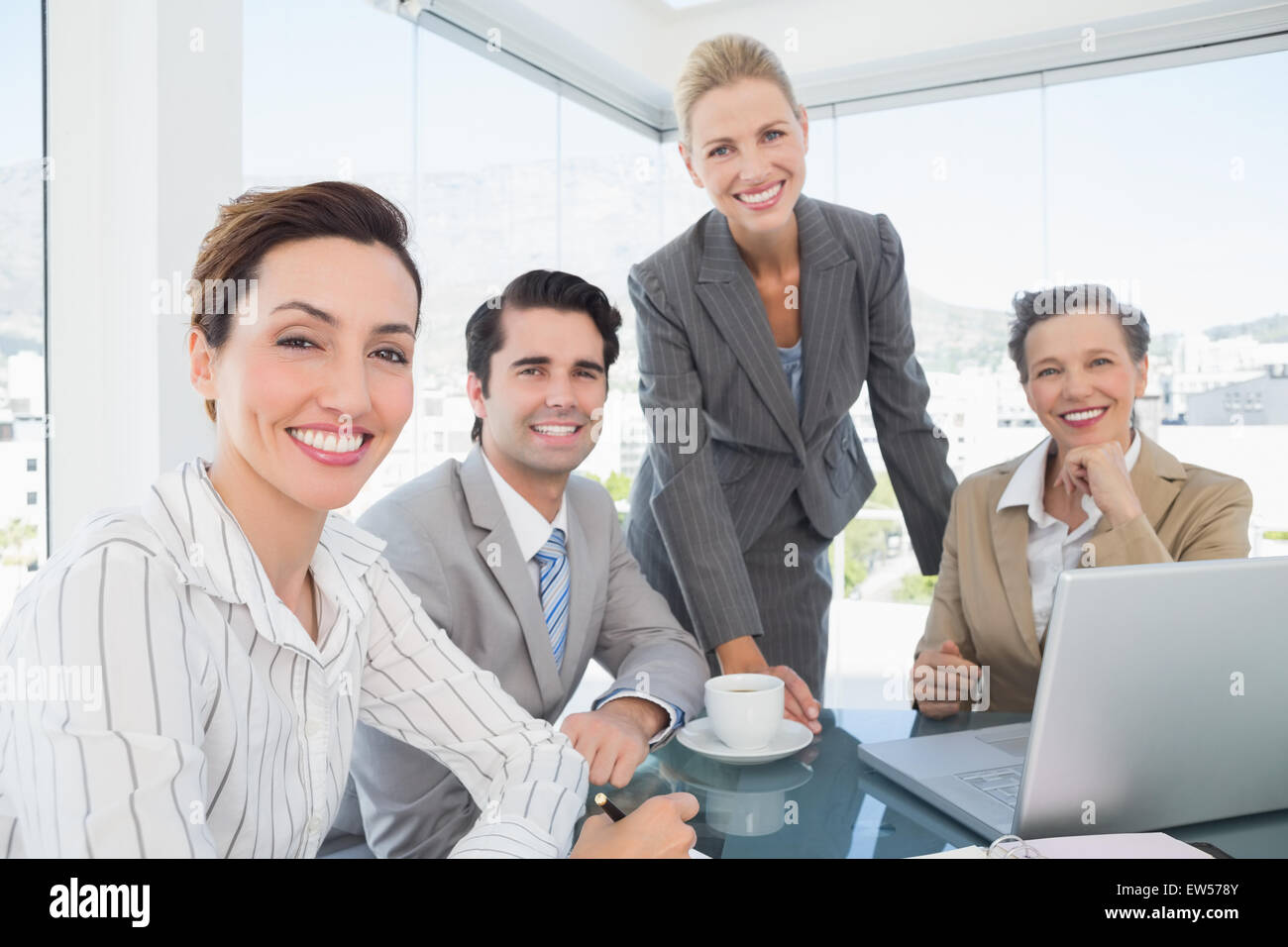 Business team working together on laptop Stock Photo - Alamy