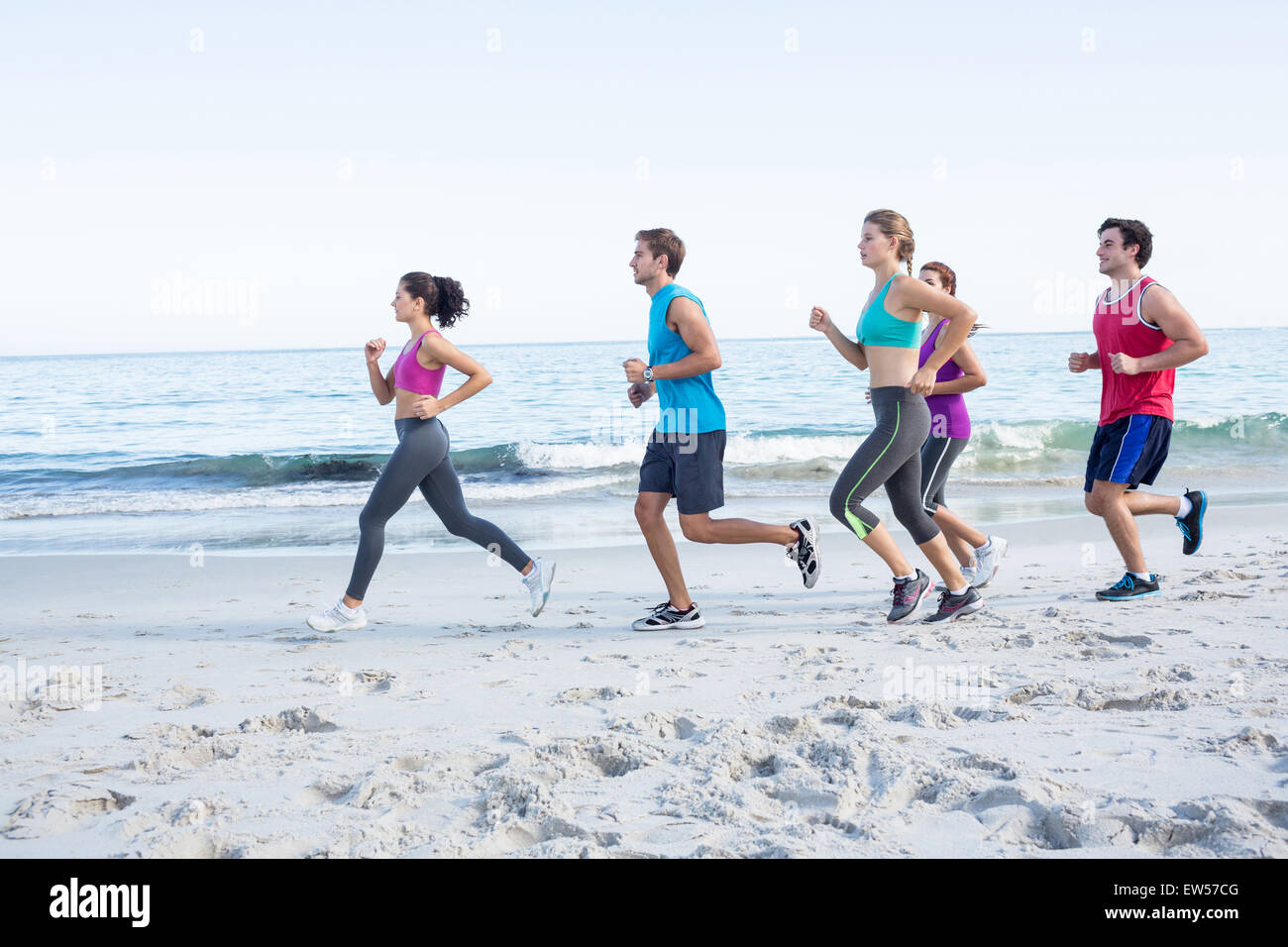 Friends doing jogging together Stock Photo - Alamy