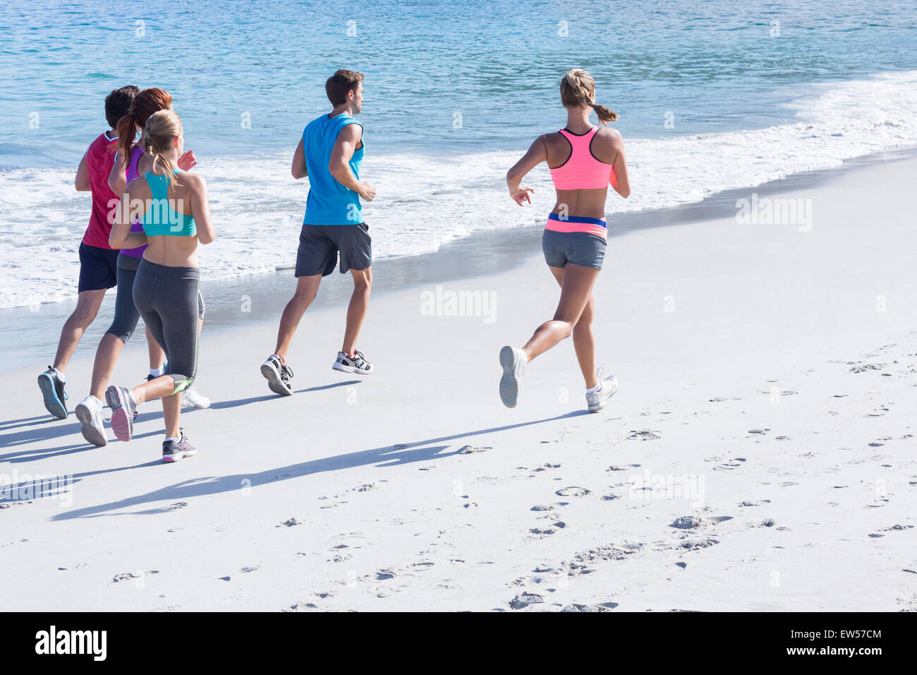 Cheerful friends working together hi-res stock photography and images ...