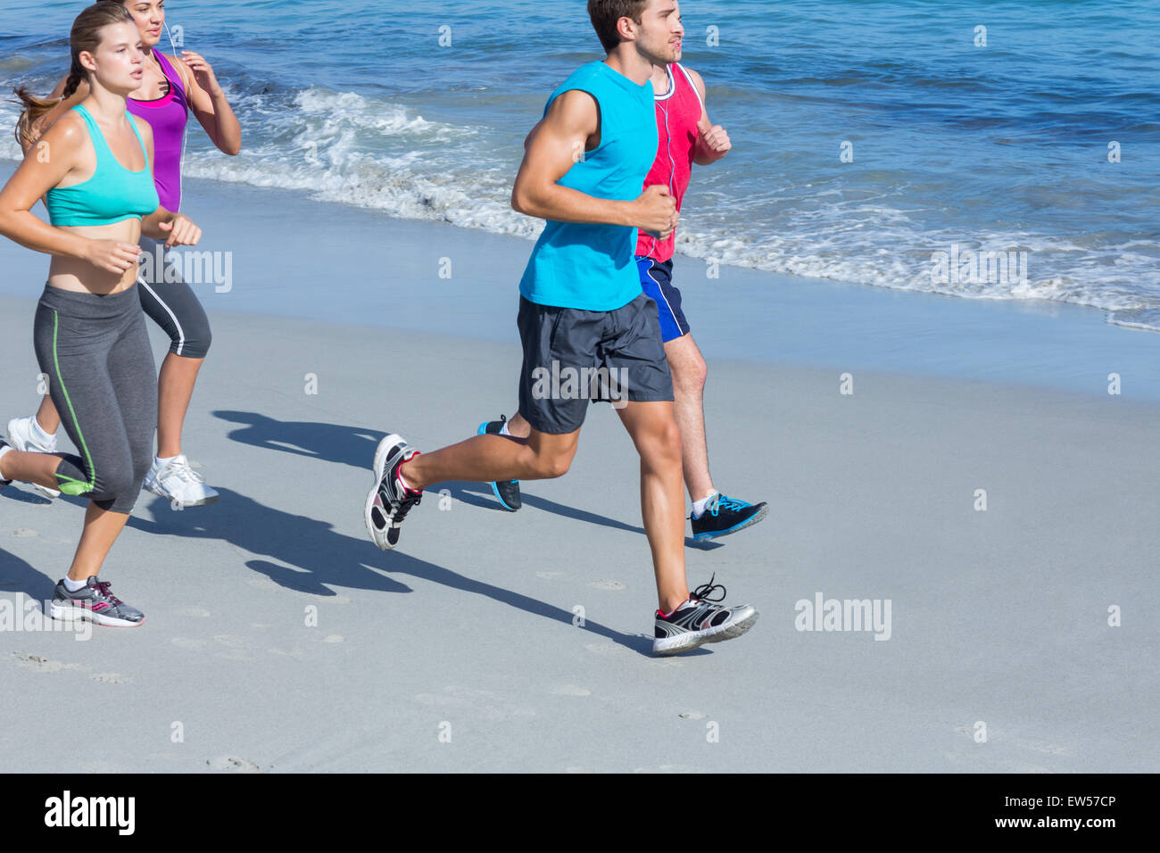 Young friends jogging together hi-res stock photography and images - Alamy