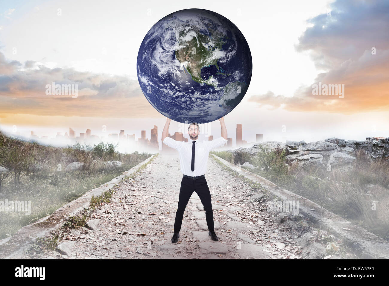Composite image of businessman carrying the world Stock Photo - Alamy