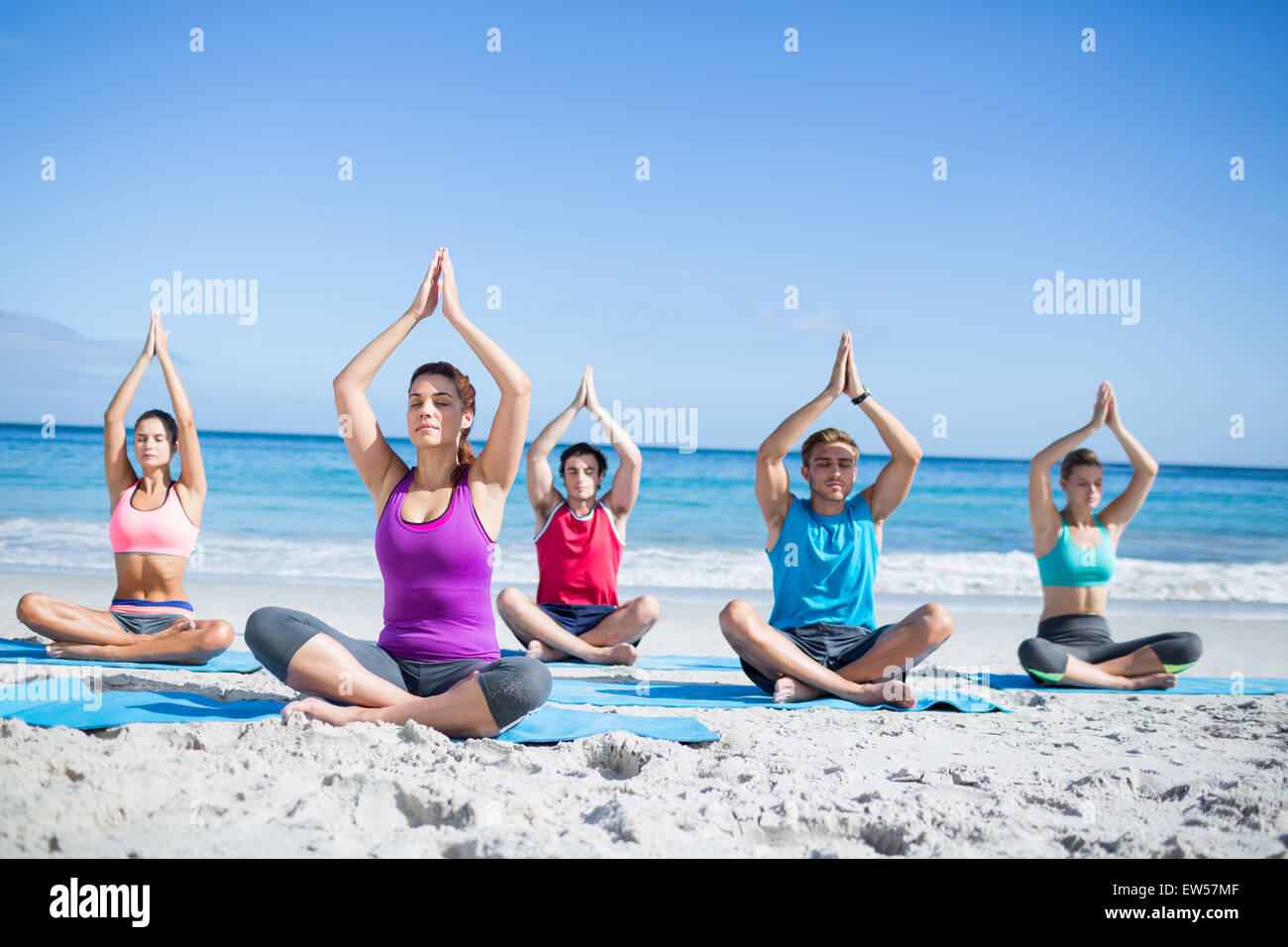 Friends doing yoga together Stock Photo - Alamy