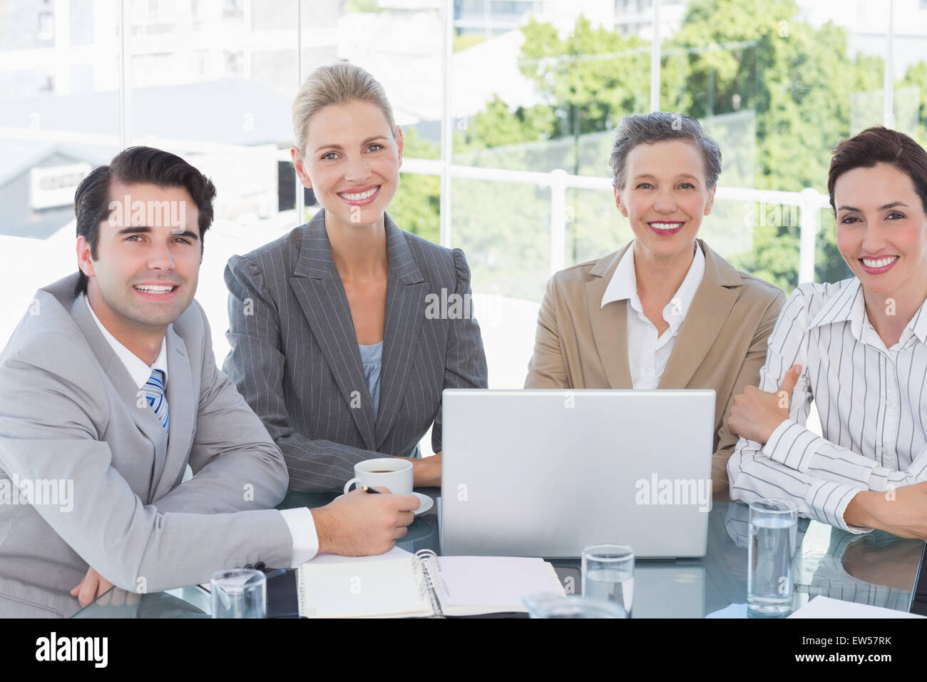 Business team working together on laptop Stock Photo - Alamy