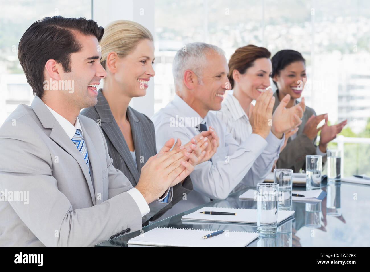 Happy woman clapping applauding team hi-res stock photography and ...