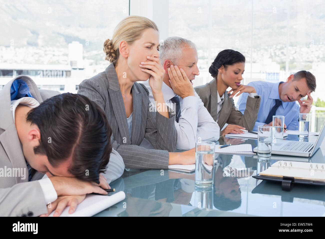Tired business team at conference Stock Photo - Alamy