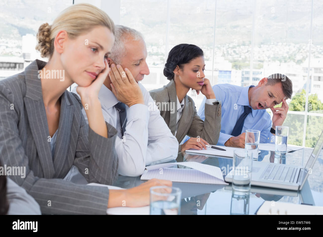 Tired business team at conference Stock Photo - Alamy