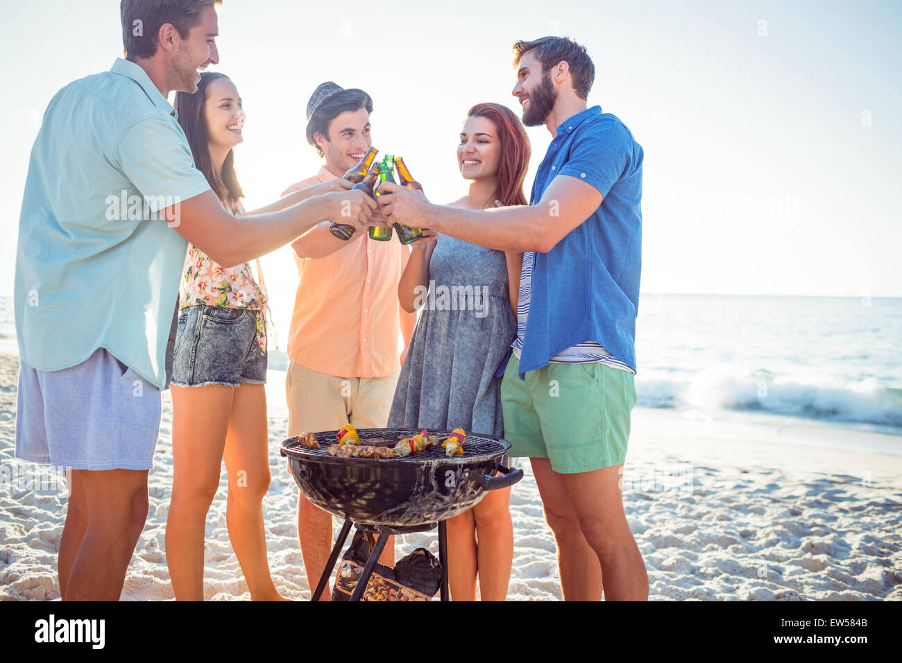 Friends talking drinking cooking barbecue hi-res stock photography and ...
