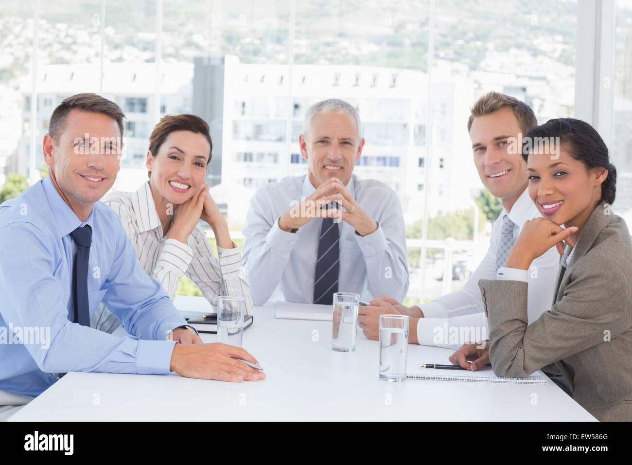 Business team smiling at camera Stock Photo - Alamy