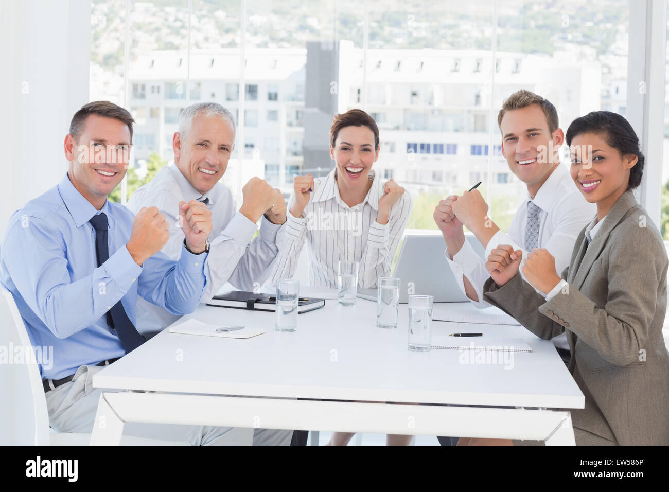 Business team smiling at camera Stock Photo - Alamy