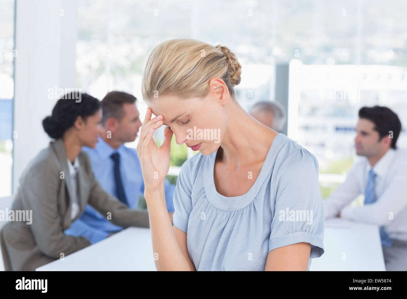 Disappointed businesswoman and her team Stock Photo - Alamy