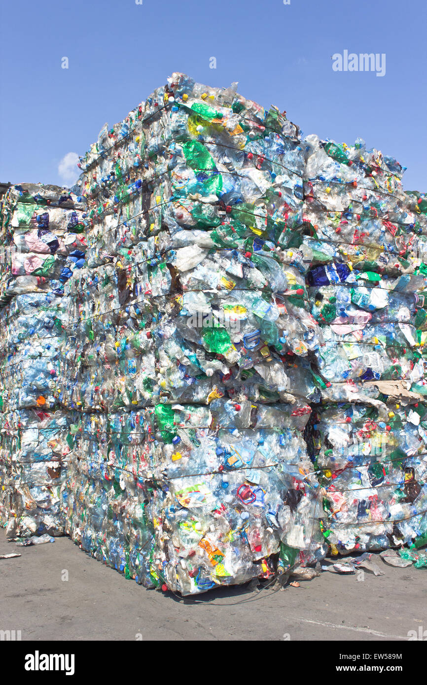 Stack of plastic bottles for recycling against blue sky Stock Photo - Alamy