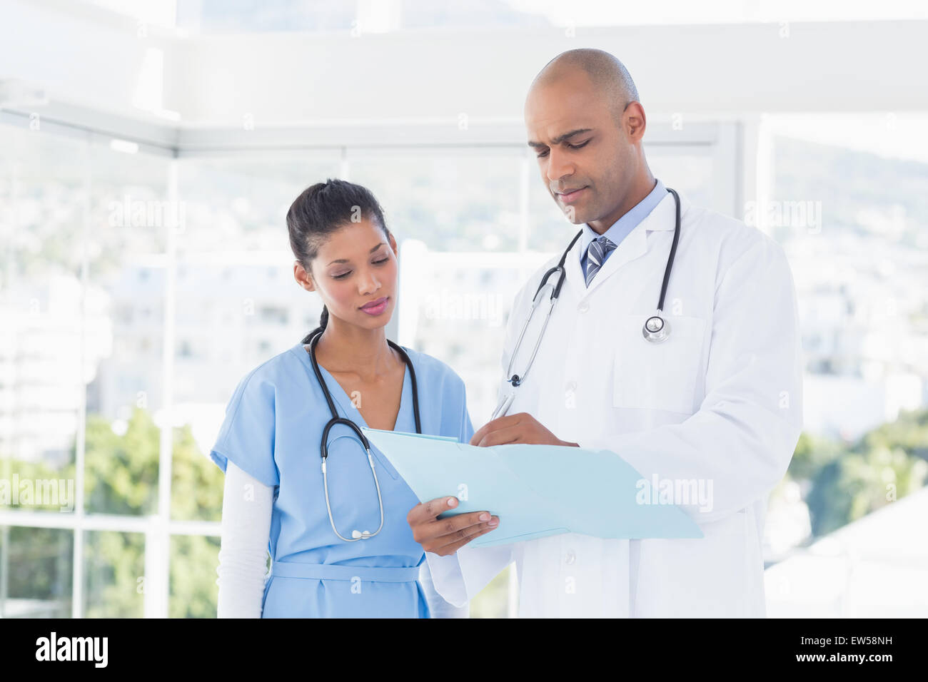 Nurse reading files woman hi-res stock photography and images - Alamy