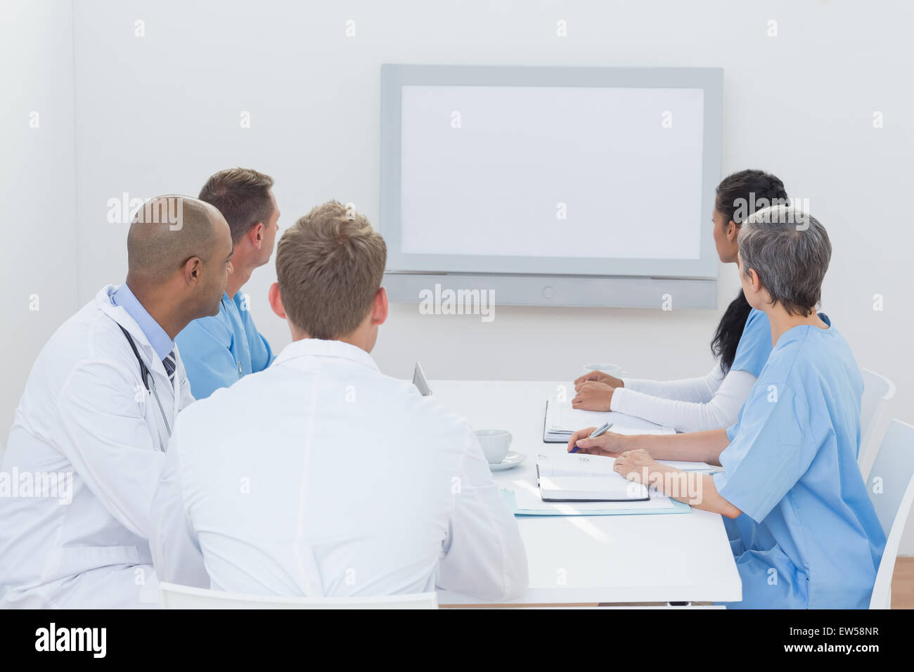Team of doctors having a meeting Stock Photo - Alamy