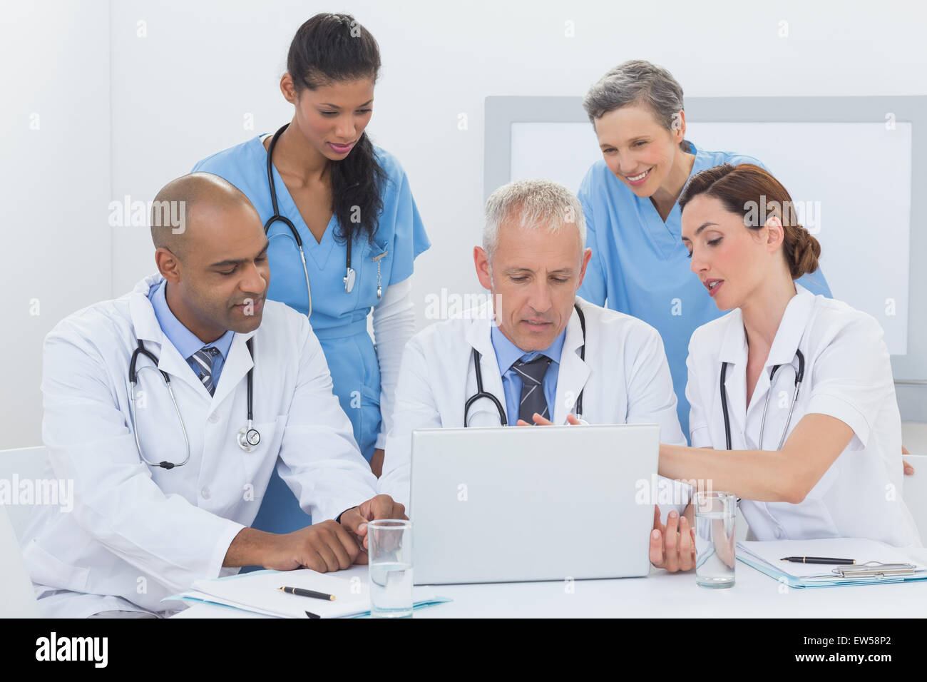 Male female doctors sitting on hi-res stock photography and images - Alamy