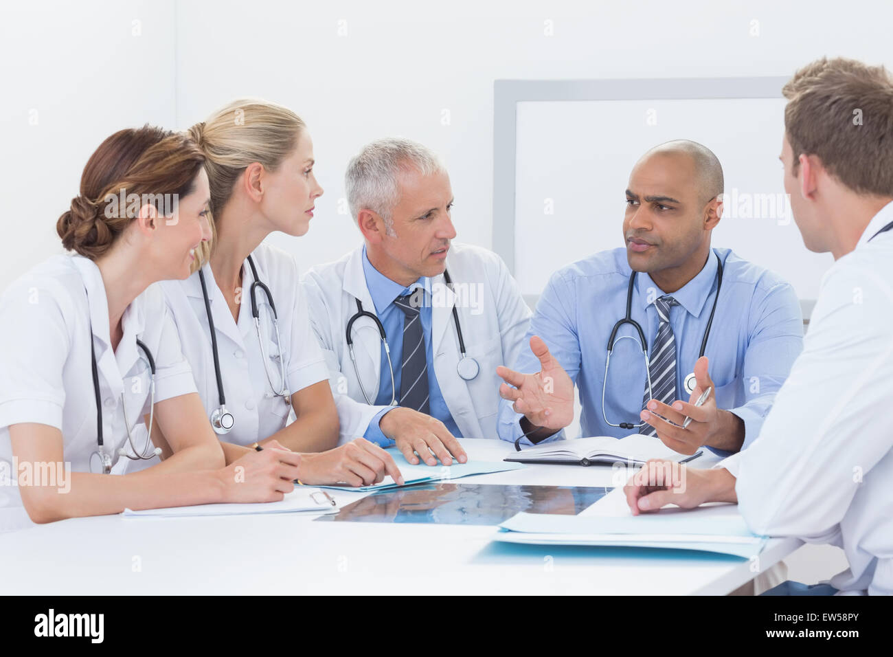 Team of doctors having a meeting Stock Photo - Alamy