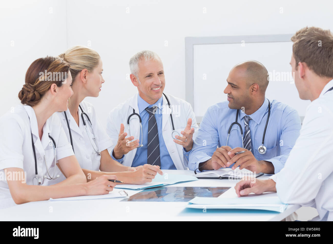 Team of doctors having a meeting Stock Photo - Alamy