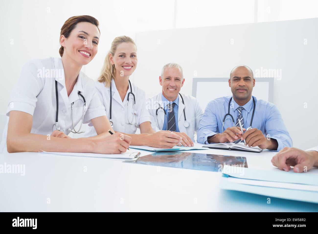 Team of doctors having a meeting Stock Photo - Alamy