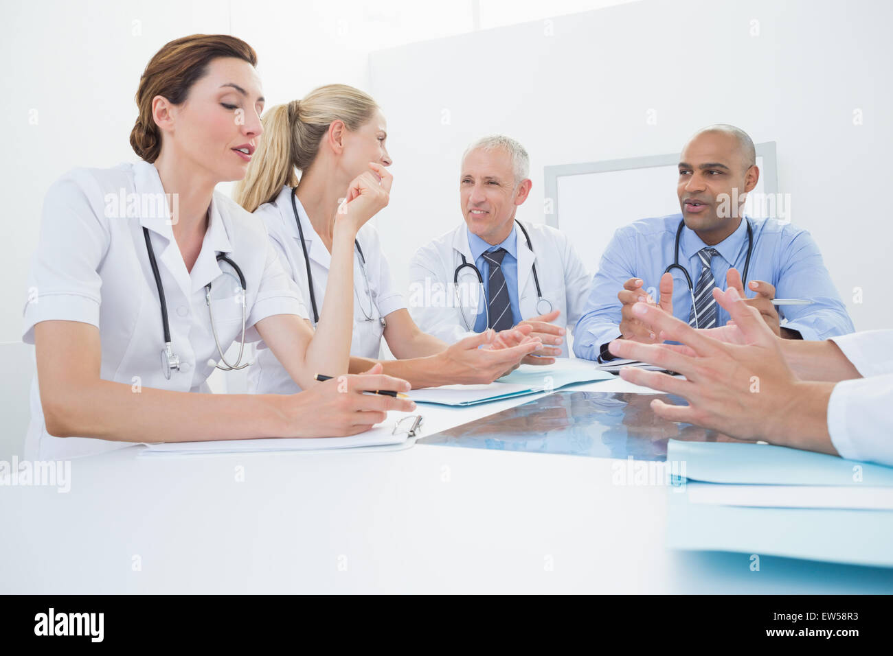 Team of doctors having a meeting Stock Photo - Alamy